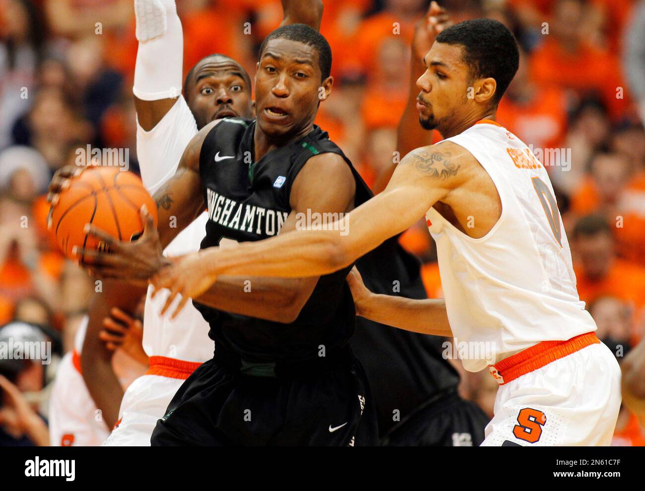 Binghamton’s Jordan Reed, center, is pressured by Syracuse’s Baye ...