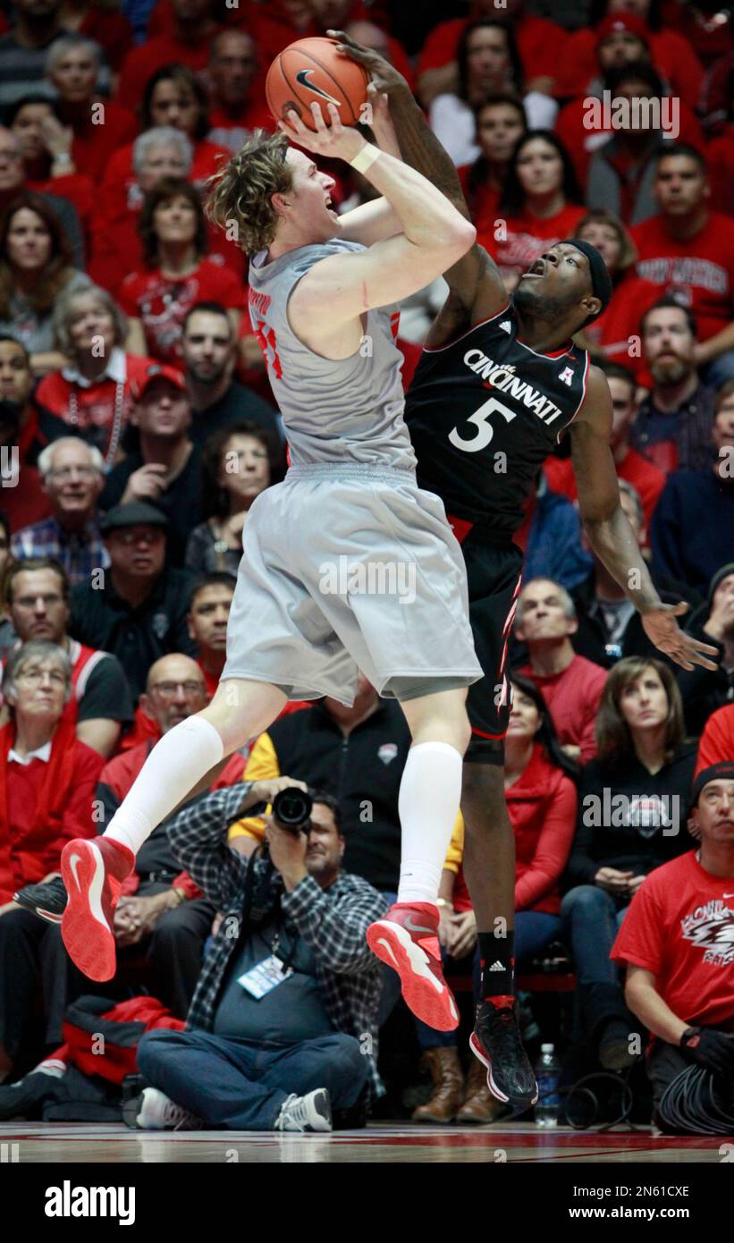 Cincinnati's Justin Jackson, right, blocks a shot by New Mexico's ...