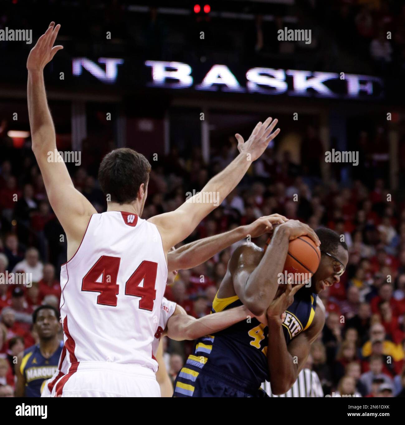 Marquette's Chris Otule, right, grabs an offensive rebound away from ...