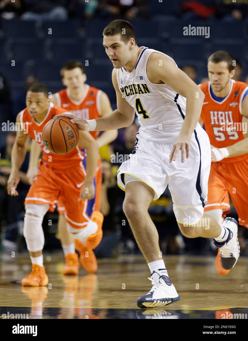 Michigan forward Mitch McGary (4) drives the ball upcourt during the ...