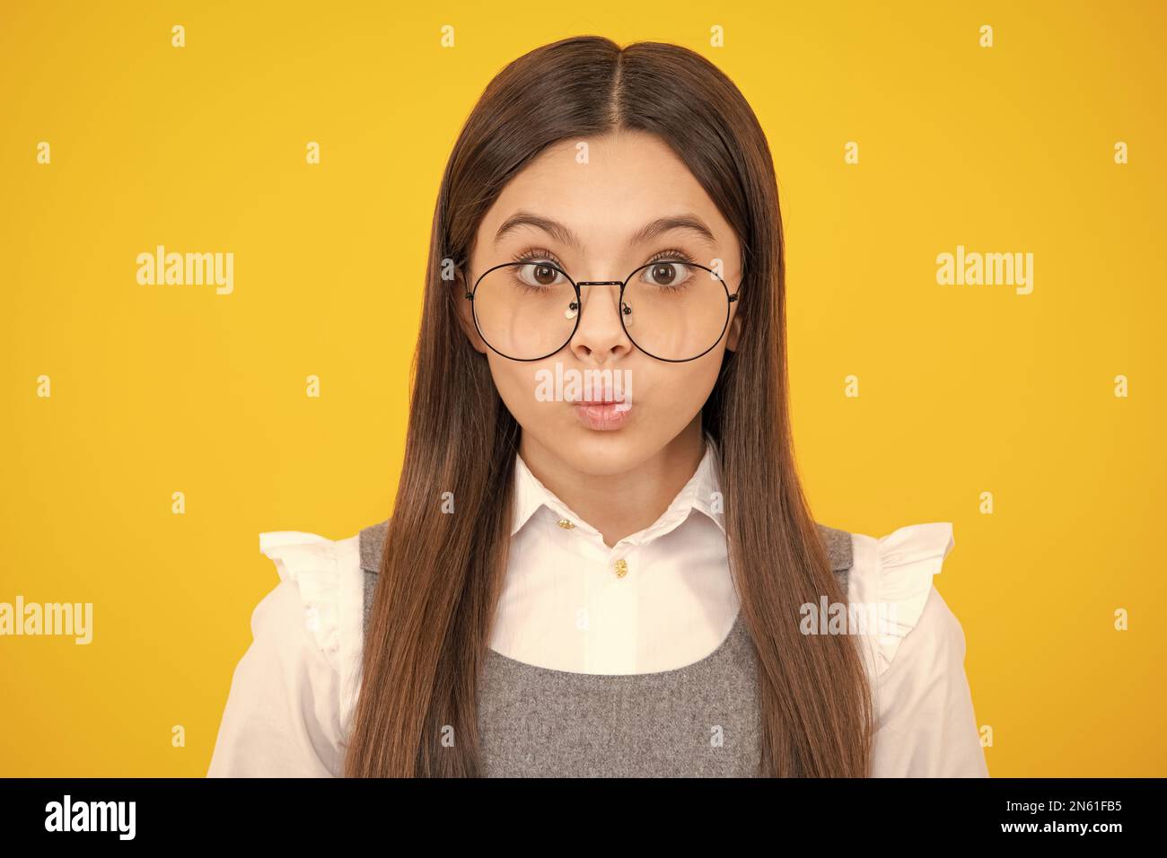 Studio shot of emotional adorable little girl surprised and shocked ...