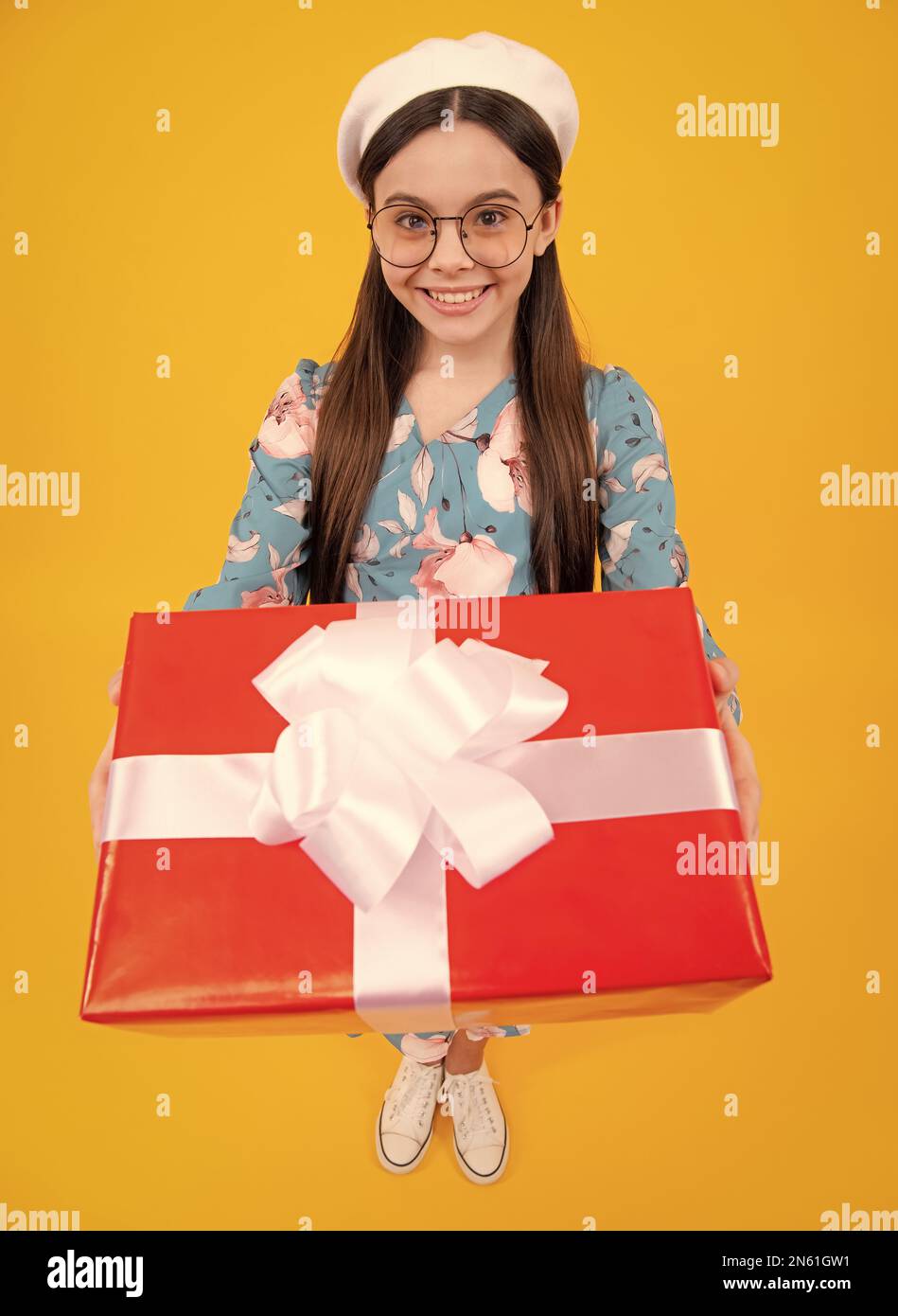 Teenager kid with present box. Teen girl giving birthday gift. Present ...