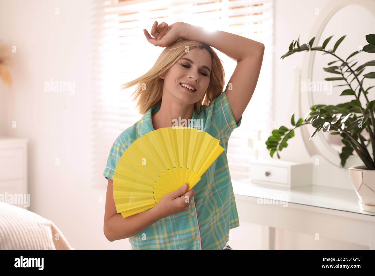 Hot woman fanning home hi-res stock photography and images - Alamy