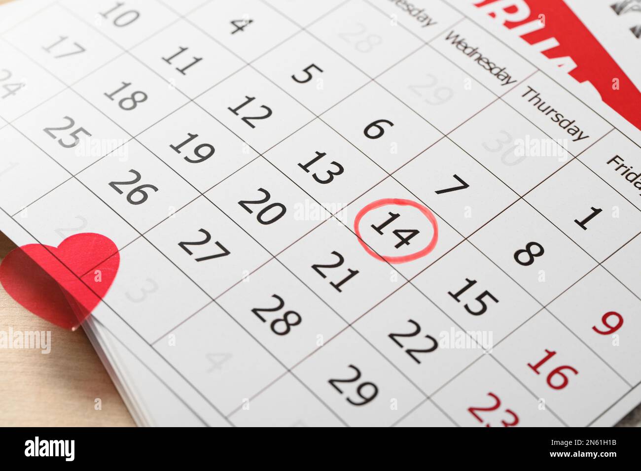 Calendar with marked Valentine's Day on table Stock Photo - Alamy