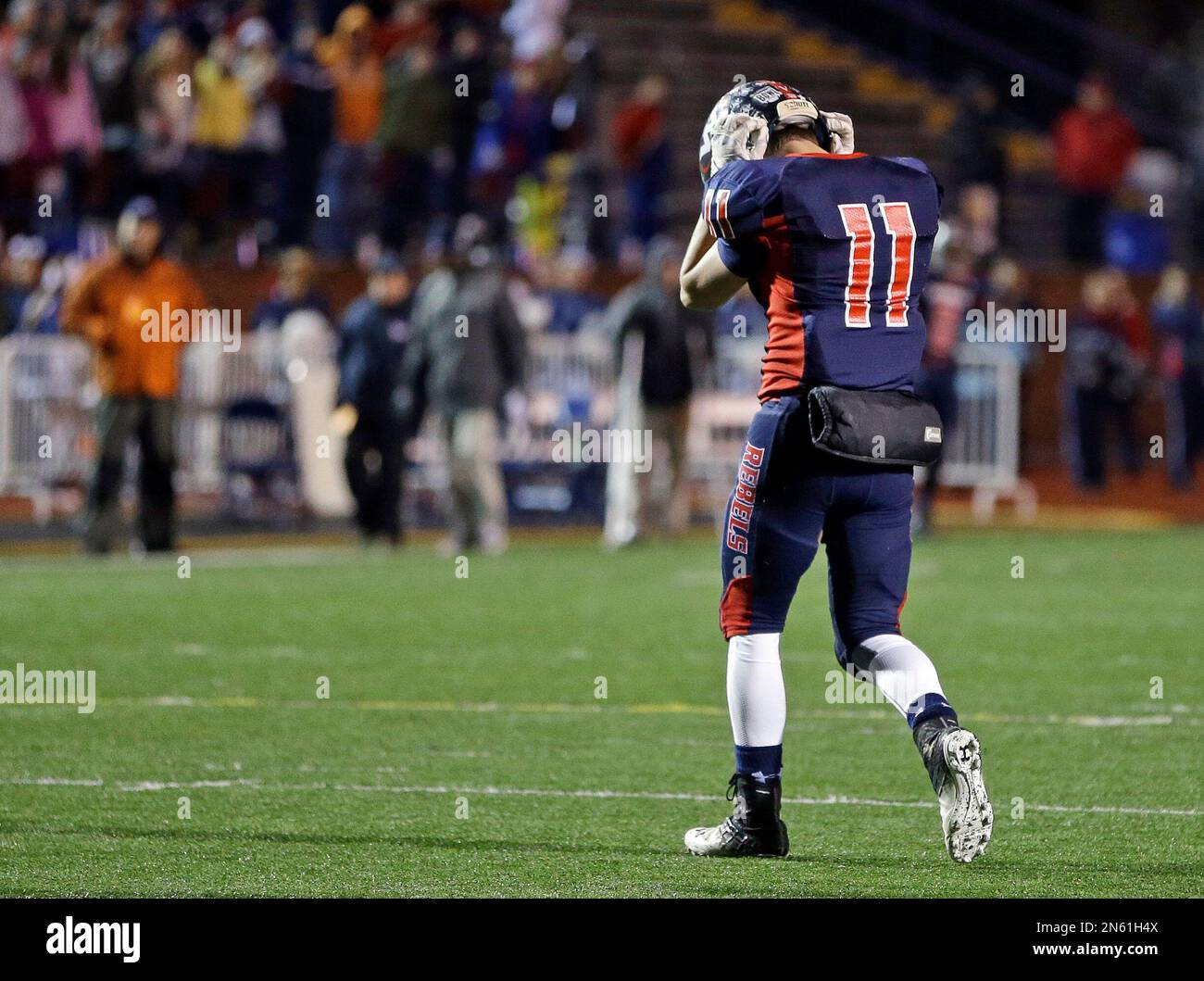 Knoxville West High School kicker Tommy Pridemore walks to the bench ...