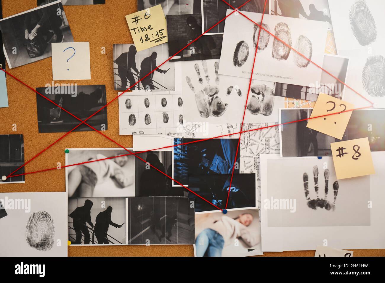 Detective board with crime scene photos, stickers, clues and red thread ...