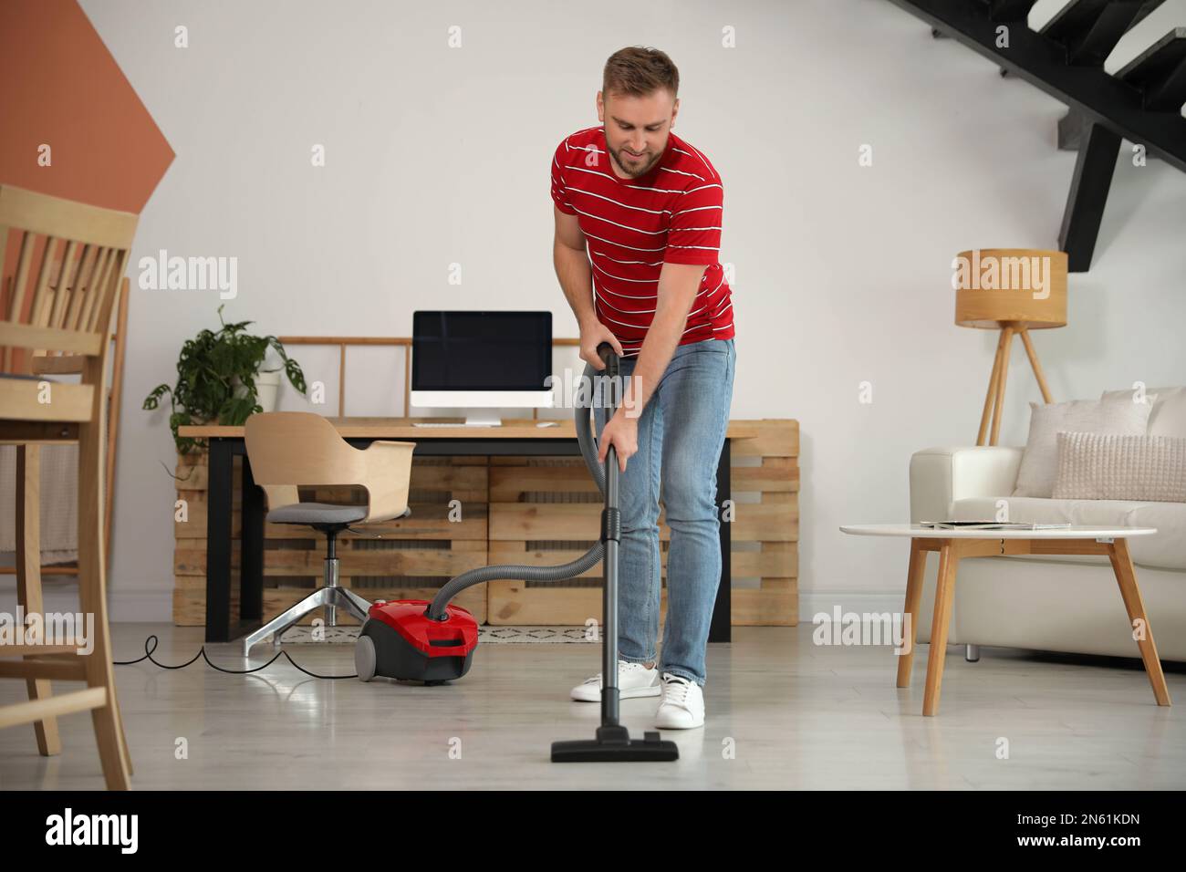Adult male using vacuum cleaner hi-res stock photography and images - Alamy