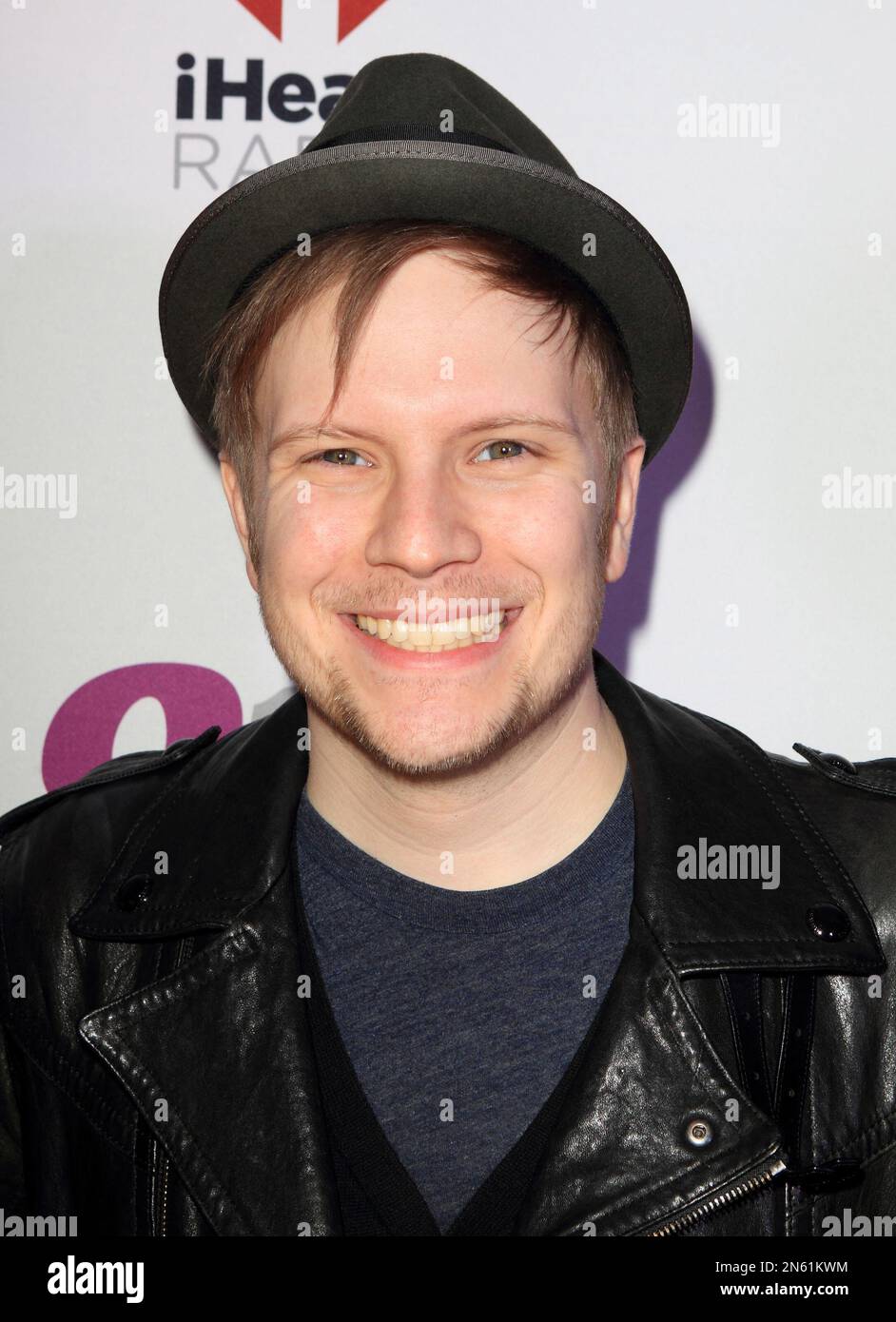 Patrick Stump of the rock band Fall Out Boy poses for photographers ...