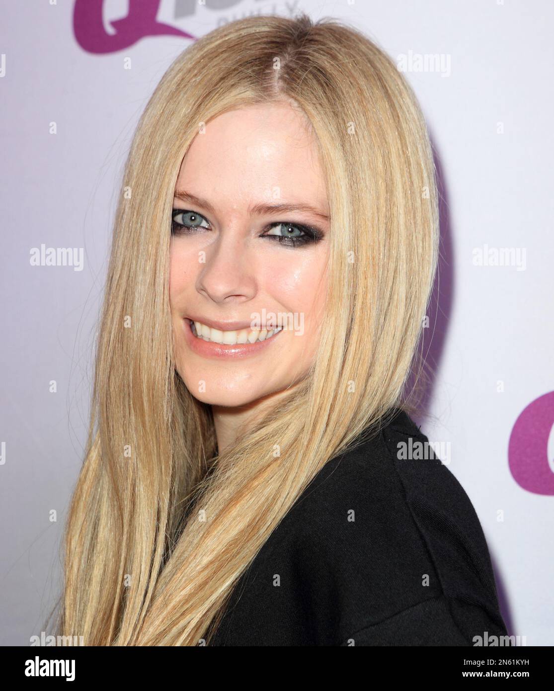 Singer songwriter Avril Lavigne poses for photographers backstage ...