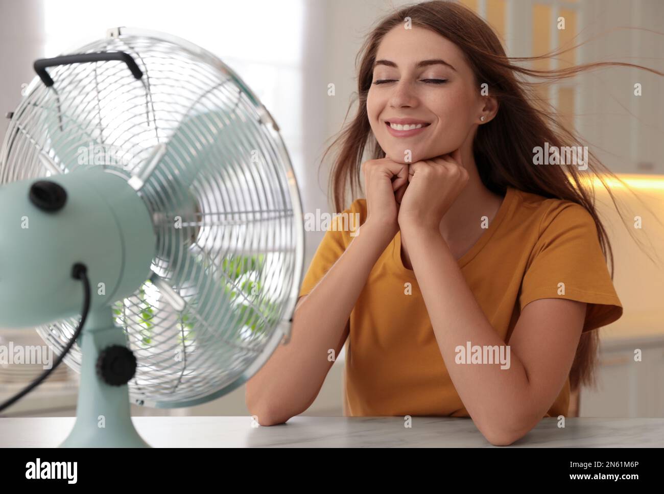 Summer heat woman smiling using hi-res stock photography and images - Alamy