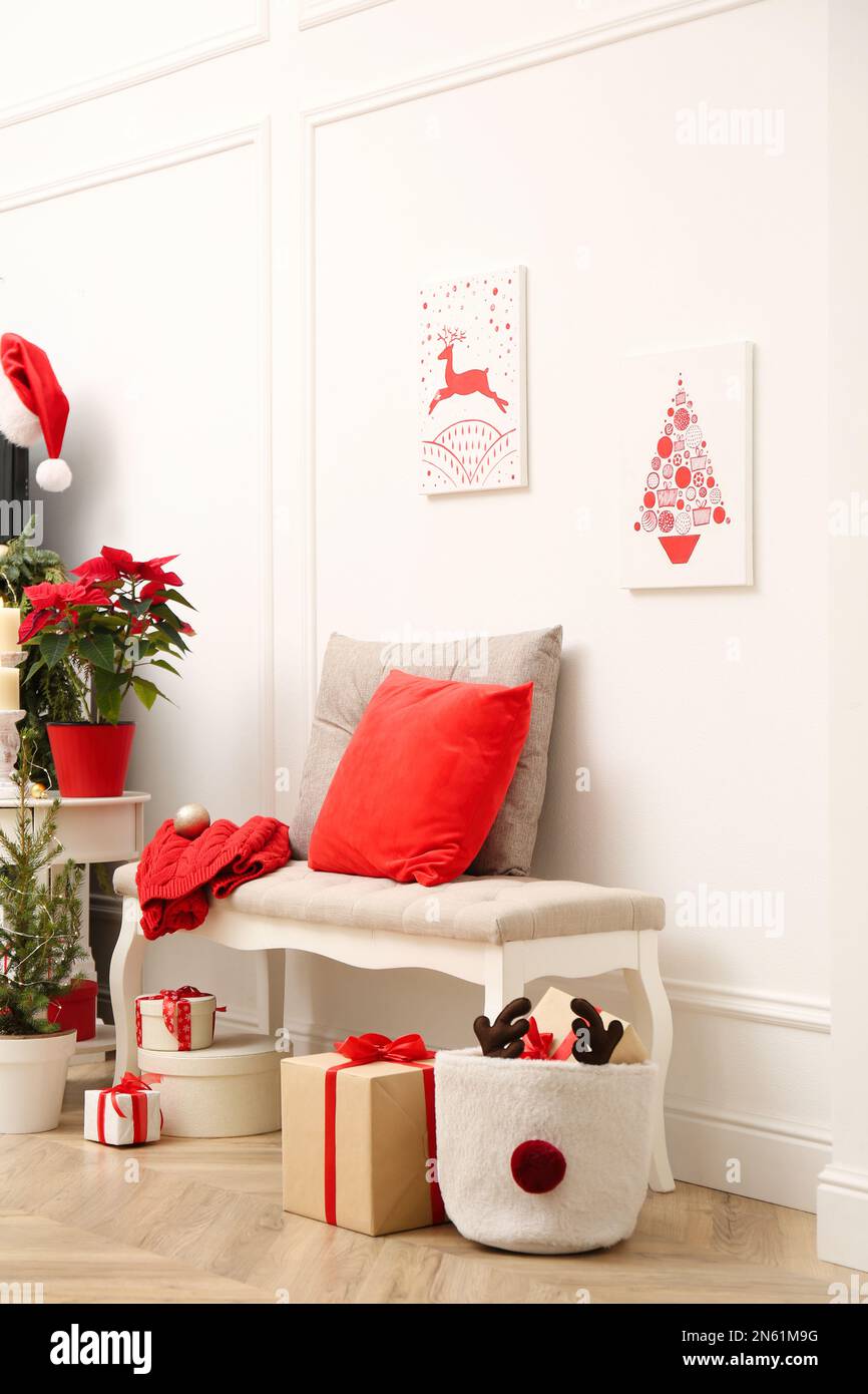 Christmas themed pictures in bright room with festive decorations ...