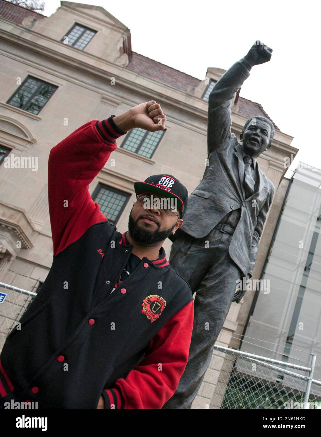 Kameron Williams, 23, of Miami, Fla. raises his fist while paying ...