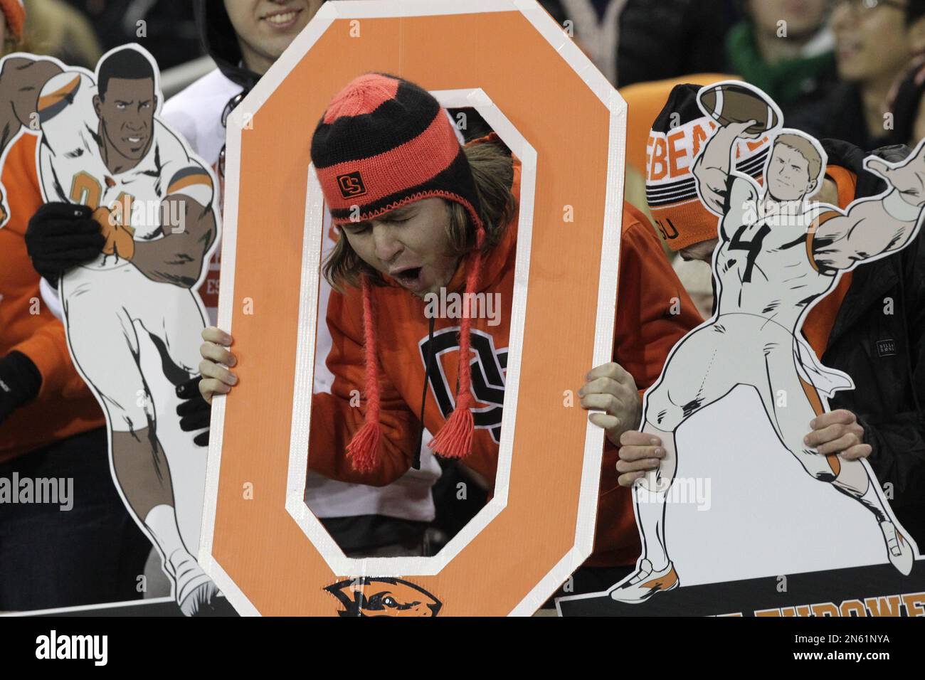 An Oregon State fan is shown during an NCAA college football game ...