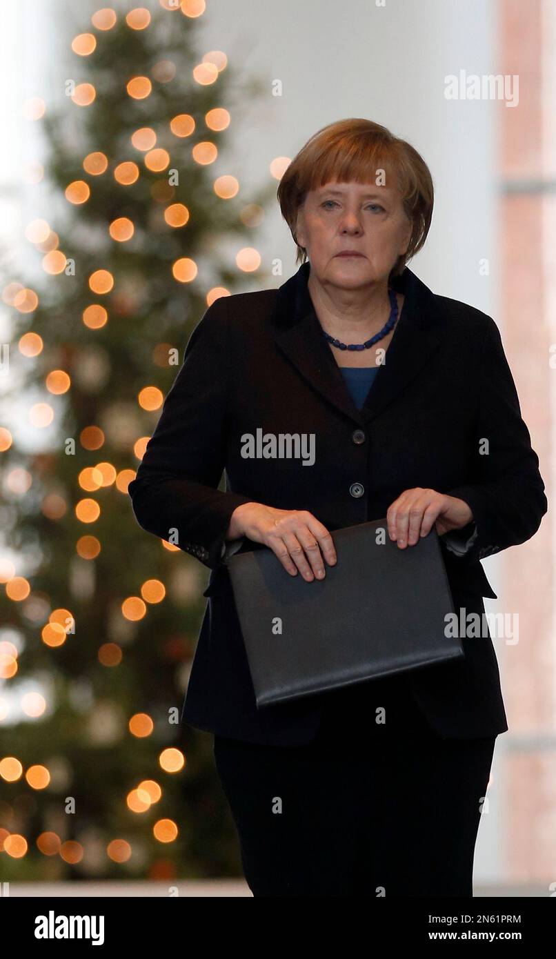 German Chancellor Angela Merkel arrives for a statement to honor former ...