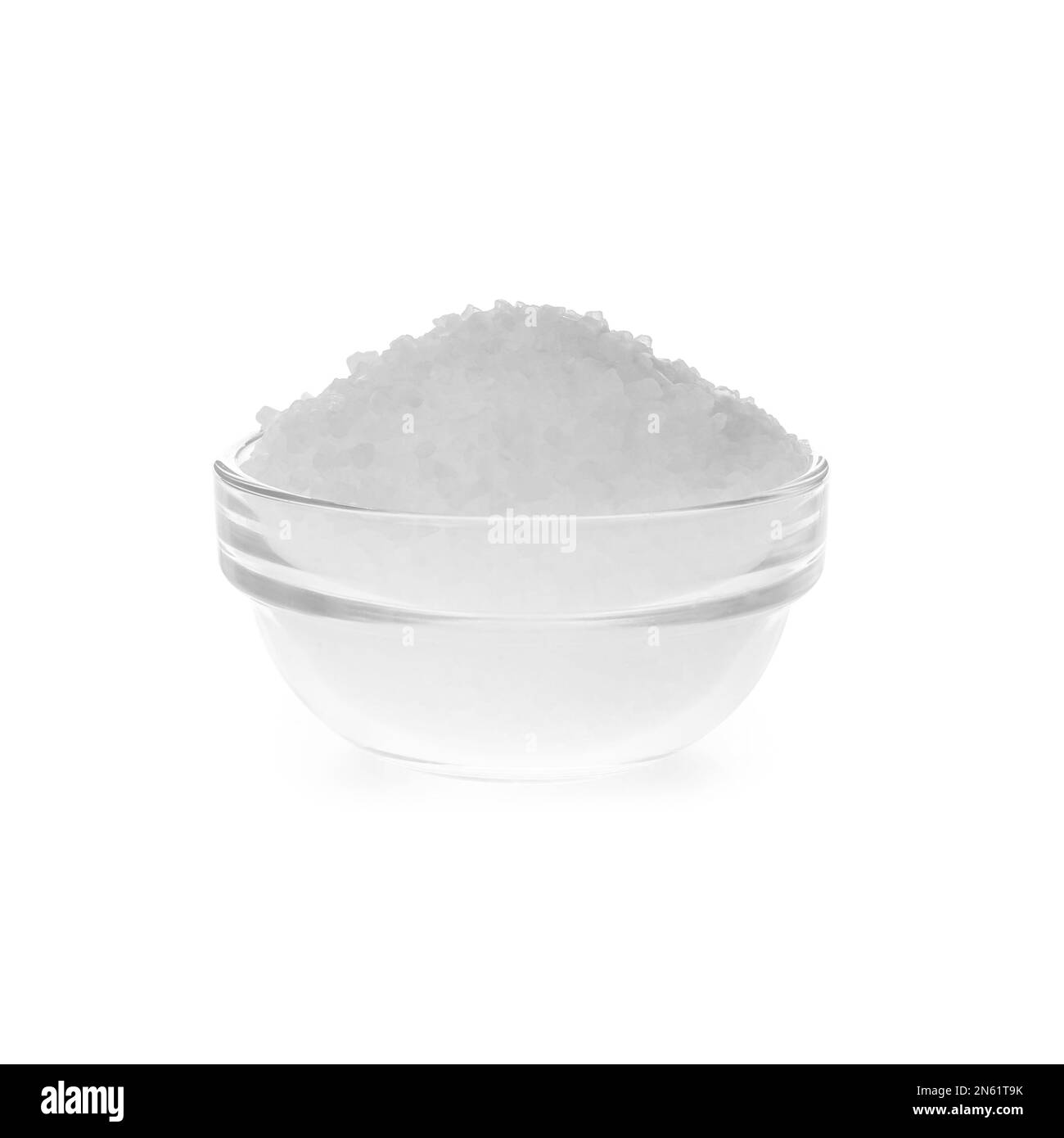 Natural salt in bowl on white background Stock Photo - Alamy