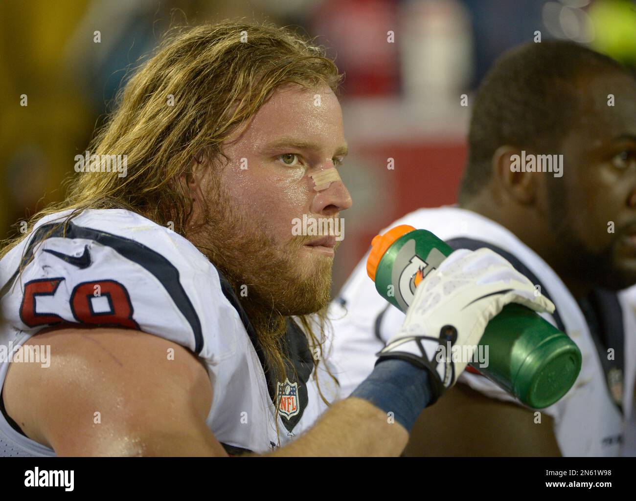 Houston Texans outside linebacker Brooks Reed takes a break on the ...