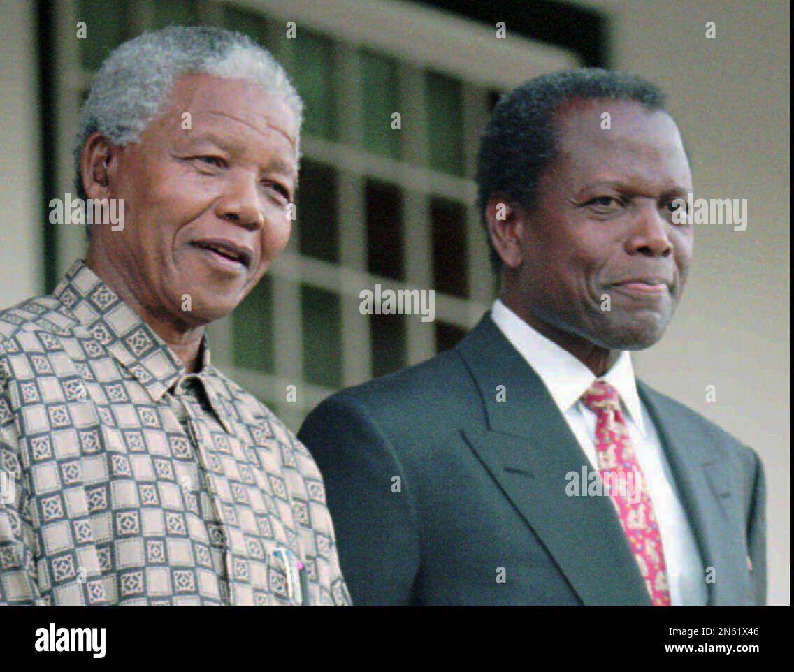 FILE - In this May 17, 1996 file photo, South African President Nelson Mandela, left, and actor ...