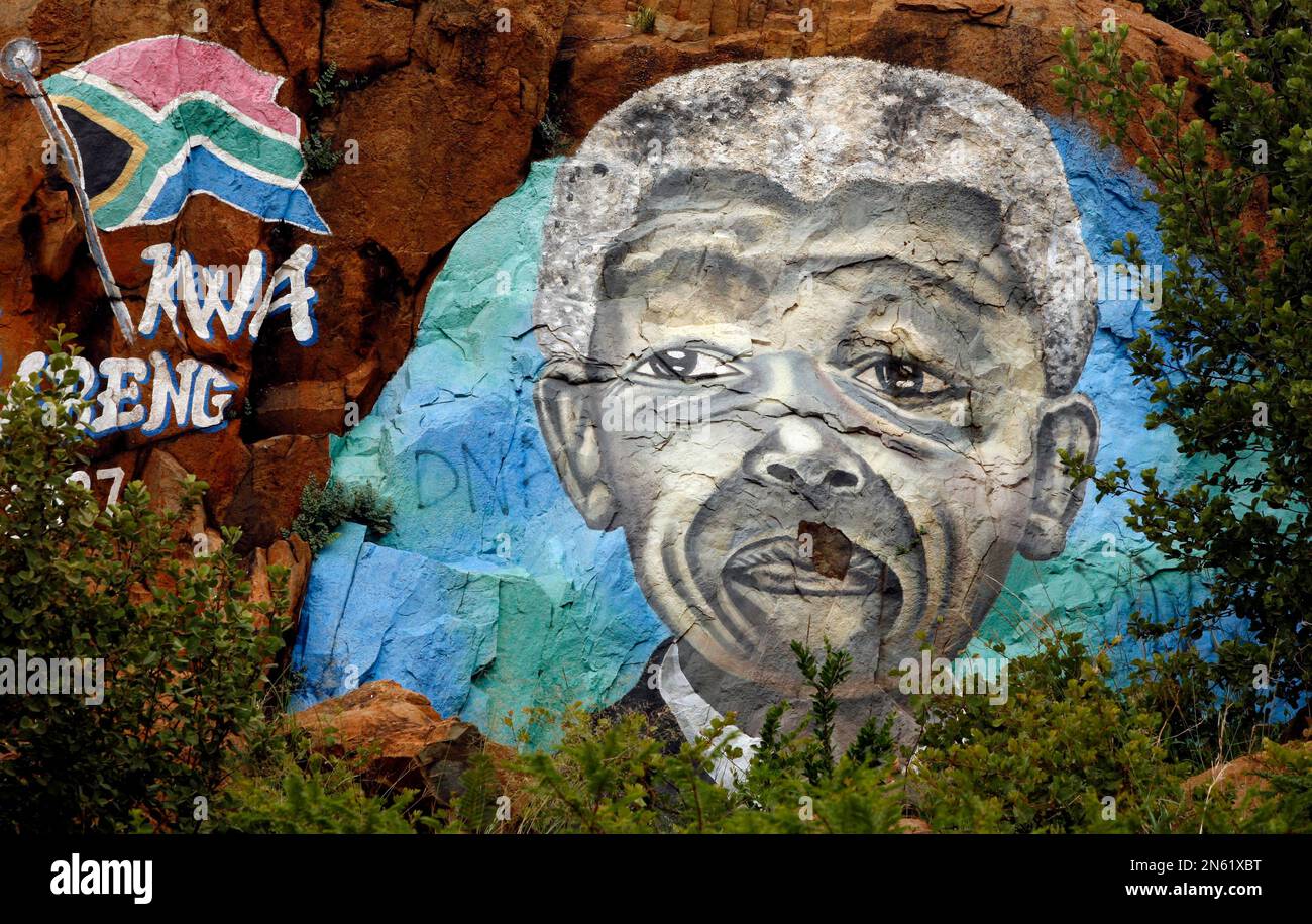 FILE - This Dec. 12, 2012 file photo shows a mural depicting former ...