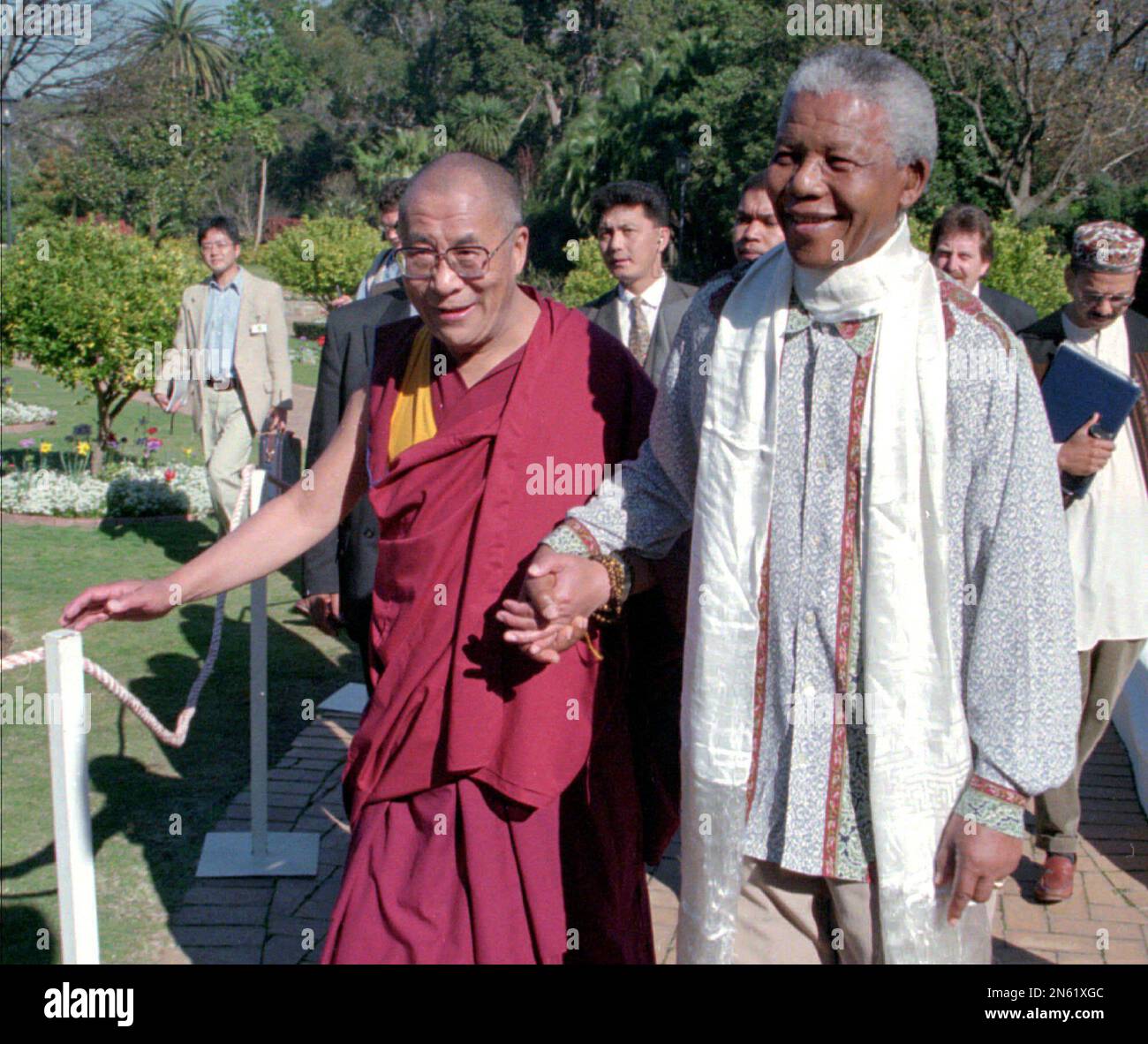 FILE - In this Aug. 22, 1996 file photo, the Dalai Lama, left, walks ...