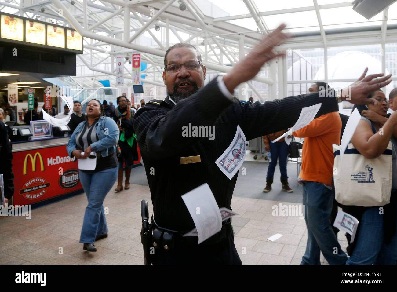 Security guards respond during a protest at a McDonald's restaurant ...