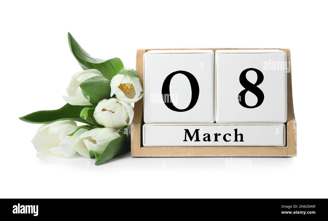 Wooden block calendar with date 8th of March and tulips on white ...
