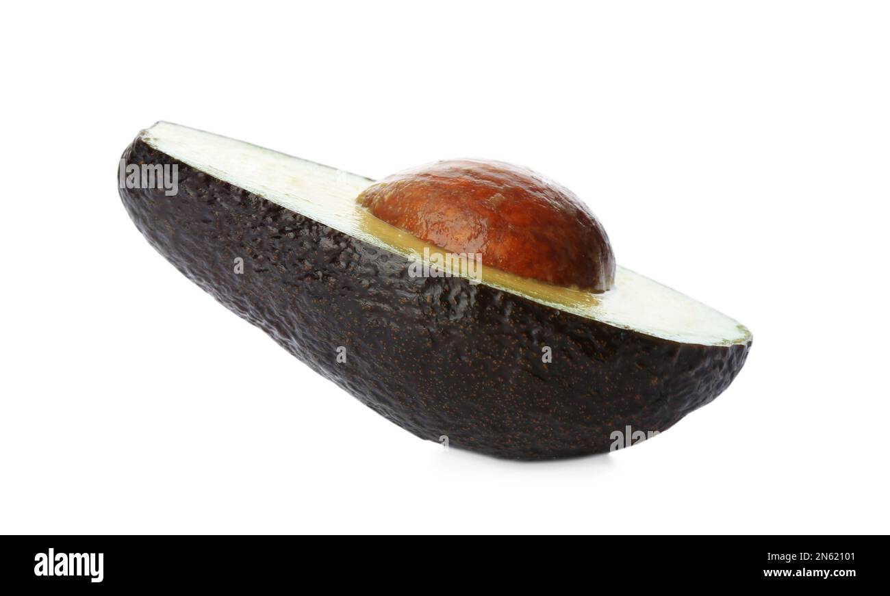 Half of ripe avocado with pit isolated on white Stock Photo - Alamy