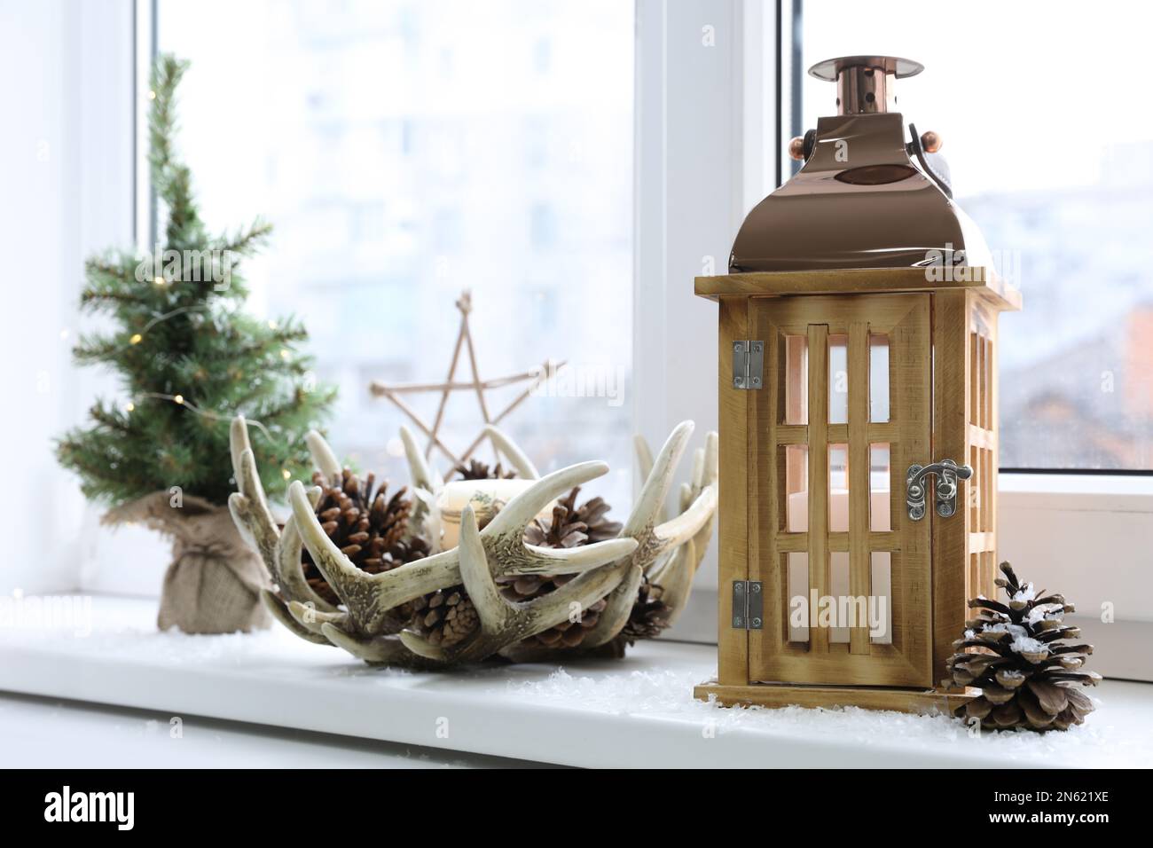 Beautiful Christmas lantern and other decorations on window sill Stock ...