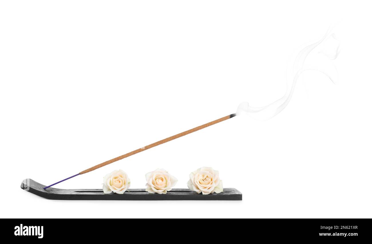 Incense stick smoldering in holder with roses on white background Stock ...