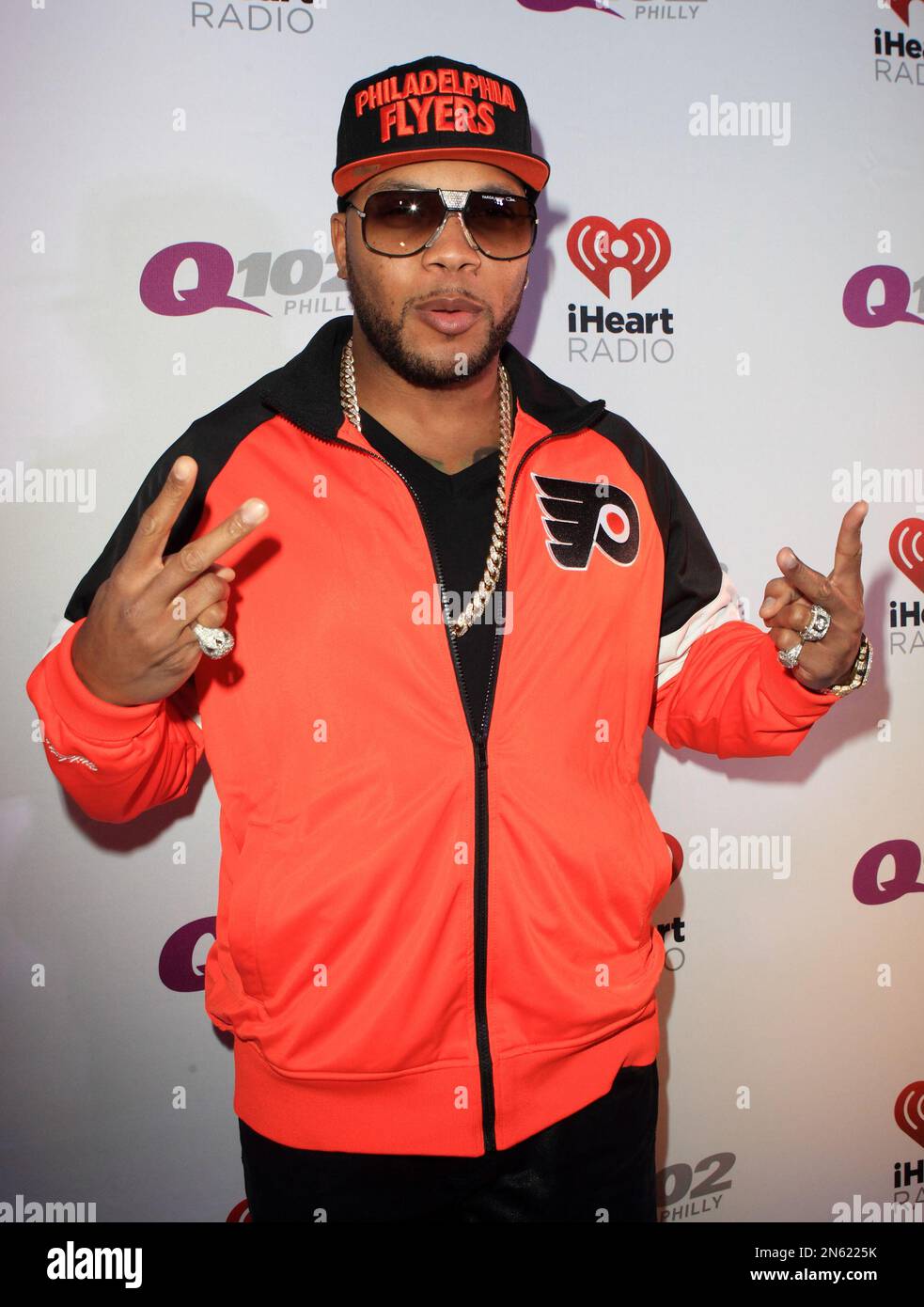 Rapper Flo Rida poses for photographers backstage during the Q102 ...