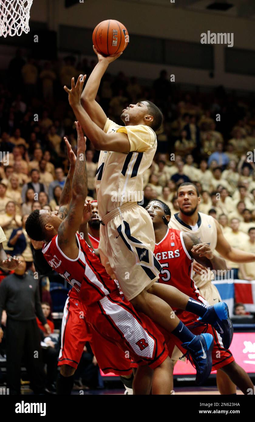 George Washington guard Kethan Savage (11) shoots over Rutgers guard D ...
