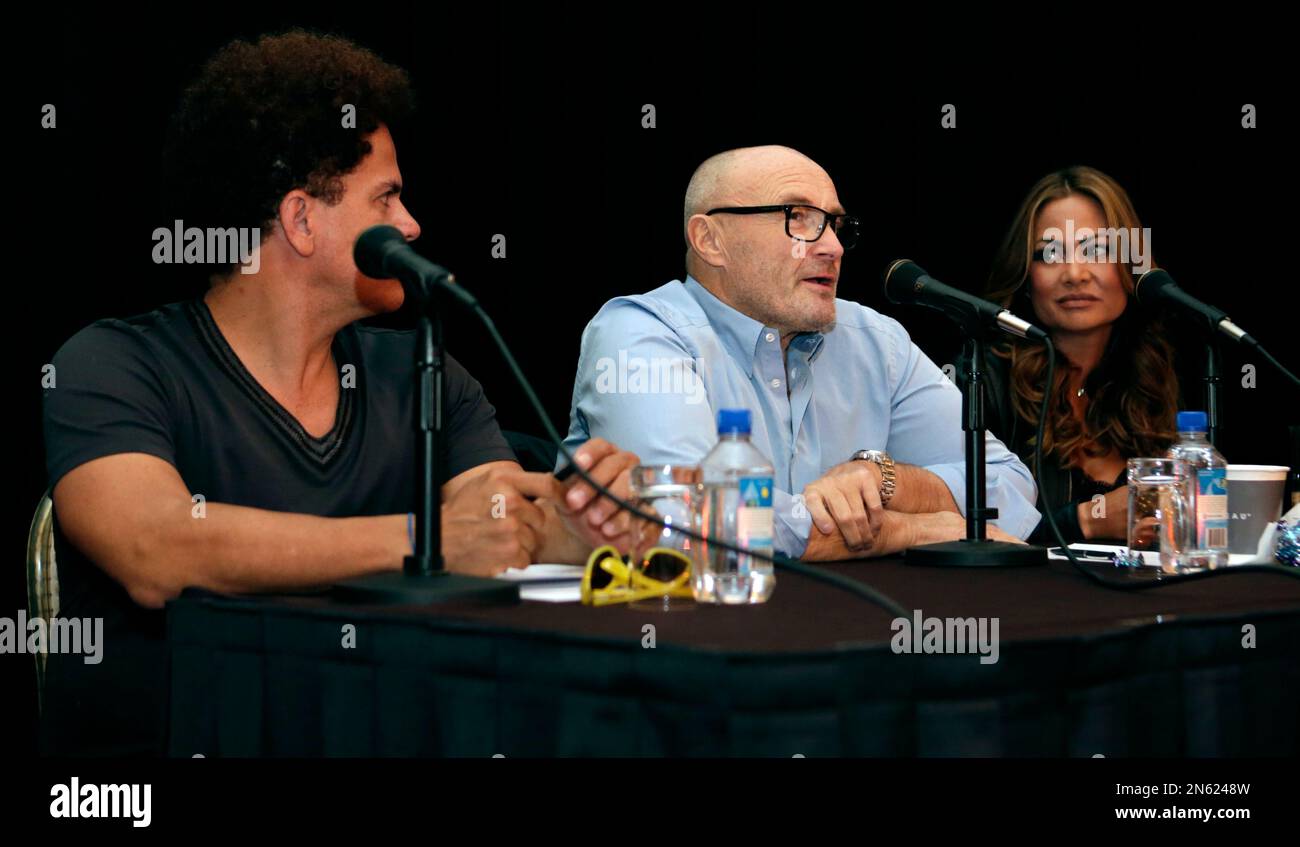 British musician Phil Collins, center, talks to guests about his Little ...