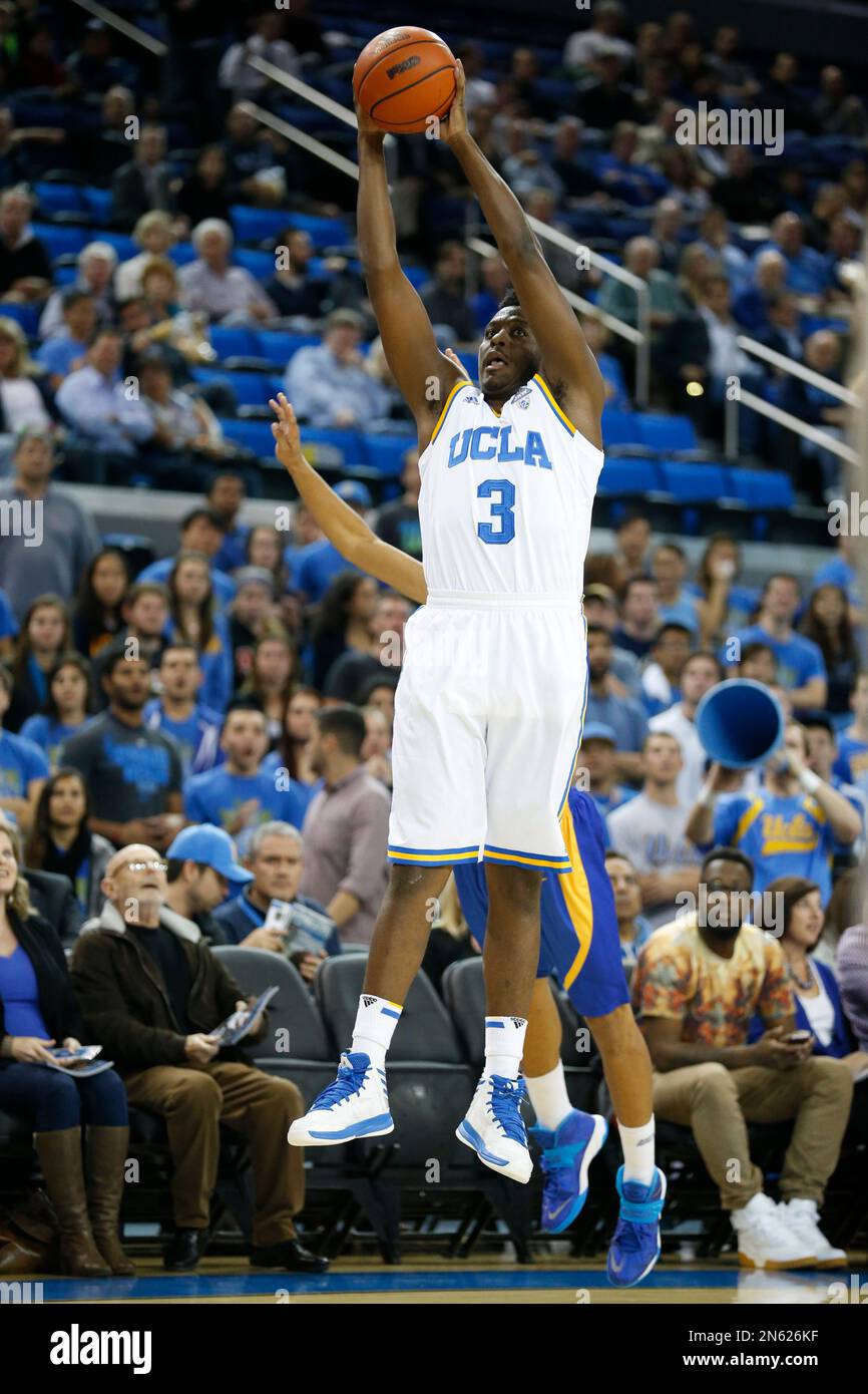 UCLA's Jordan Adams, left, steals the ball on a pass intended for UC ...