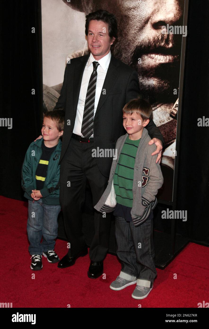 Actor Mark Wahlberg, center, with his sons Brendan Wahlberg, left, and ...