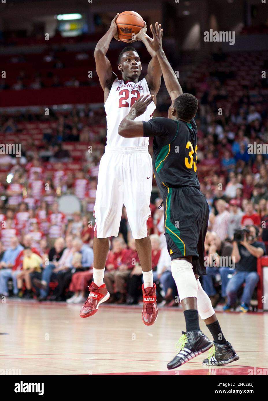 Arkansas' Jacorey Williams (22) shoots a basket over Southeastern ...