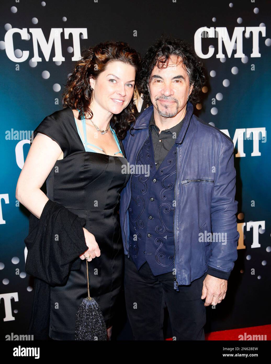 John Oates and his wife, Aimee Oates, pose on the red carpet at the CMT ...