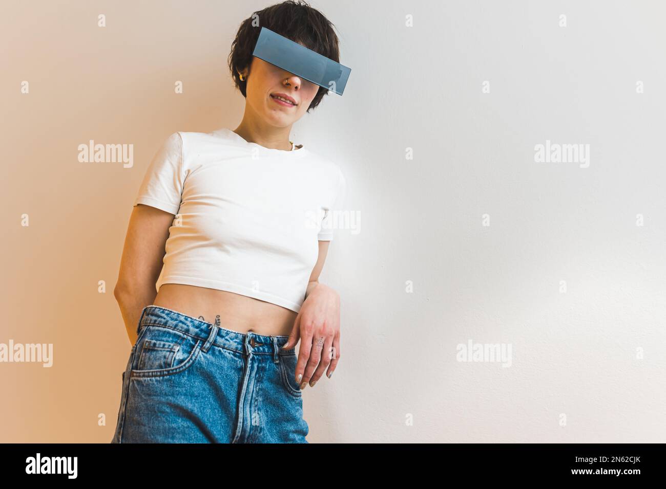 Stylish slim person wearing rectangular sunglasses and posing to the ...