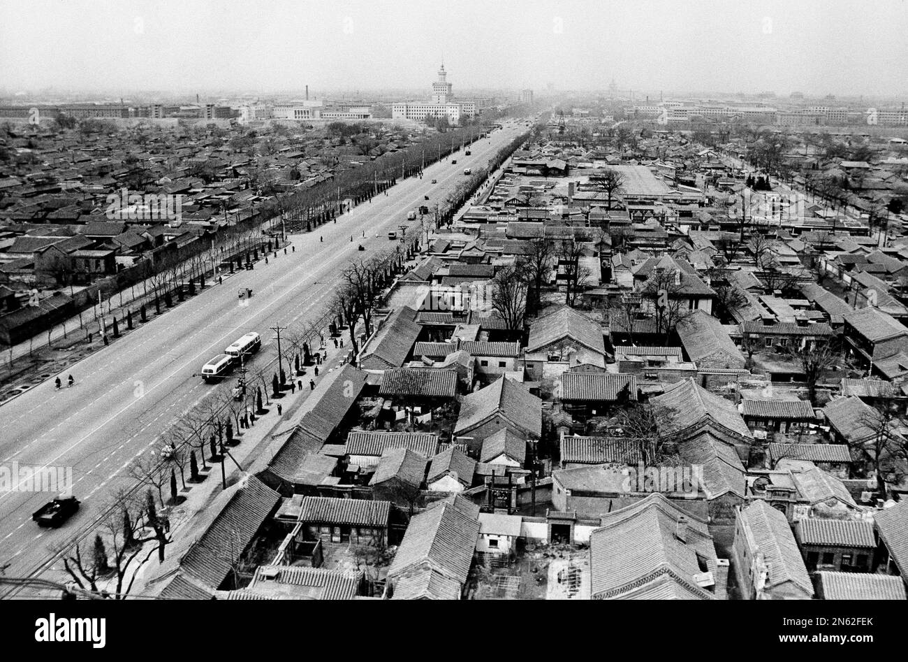 Main street in Peking, China with older type housing estates on right ...