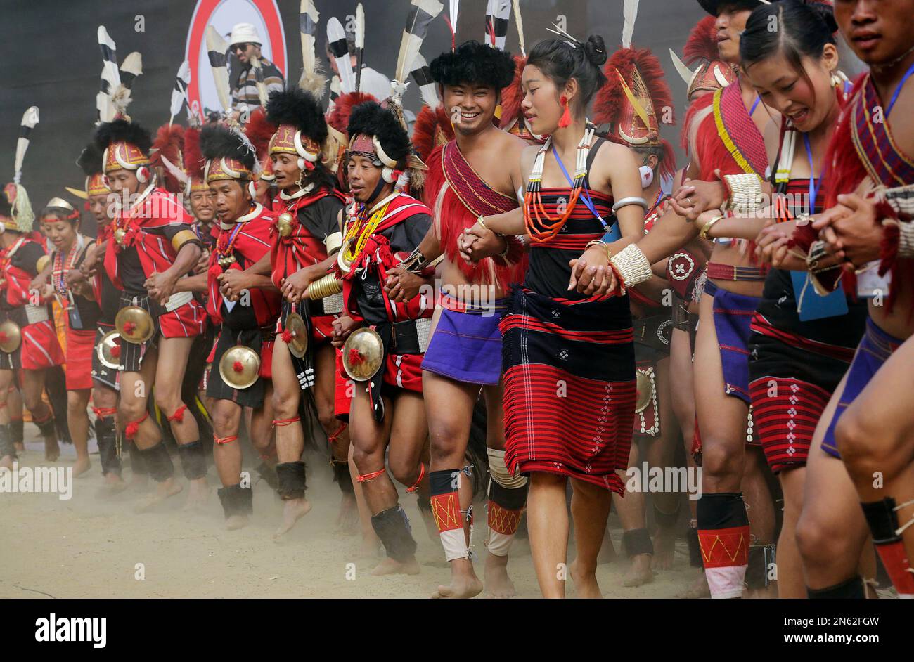 India's Naga tribe dancers in traditional attire, perform a dance during the Hornbill festival ...