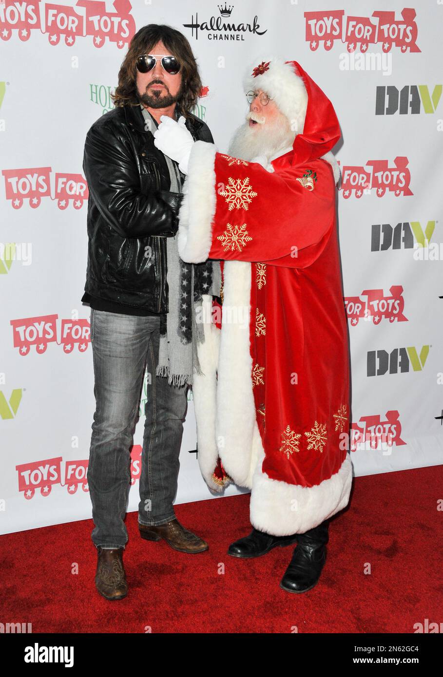 Billy Ray Cyrus, left, and Santa Claus arrive at the 82nd Annual ...