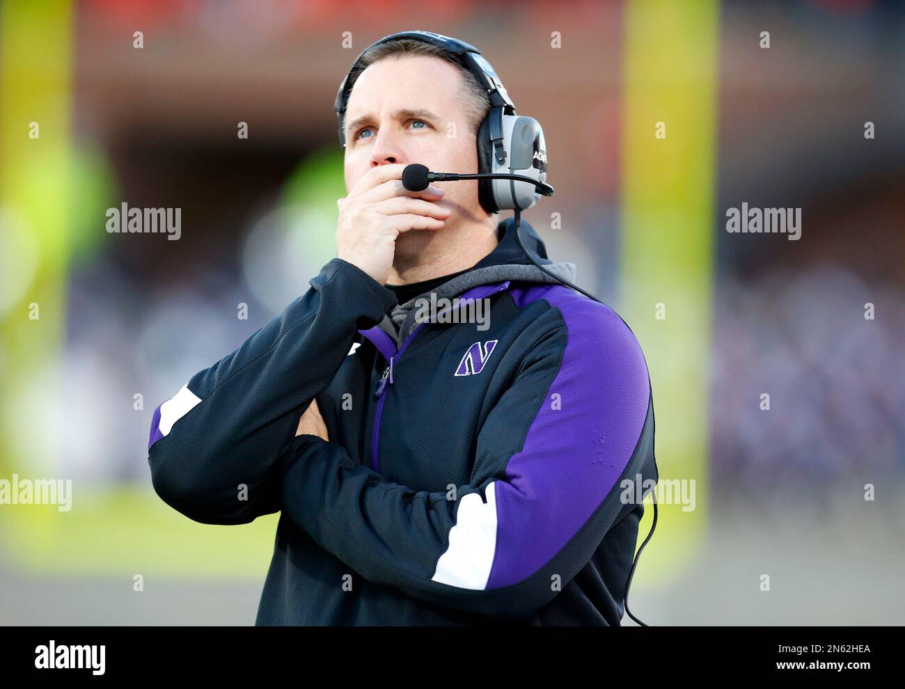 Northwestern head coach Pat Fitzgerald looks at the scoreboard during ...