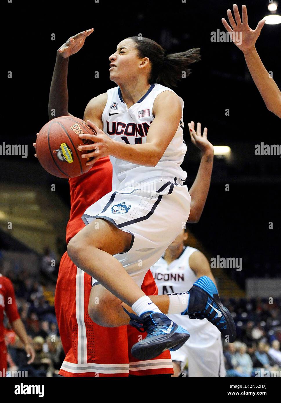 Connecticut's Bria Hartley, right, drives past Ohio State's Darryce ...
