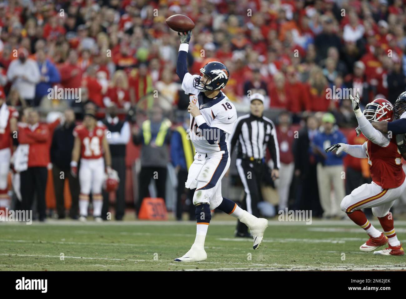 Denver Broncos quarterback Peyton Manning (18) works against the Kansas ...