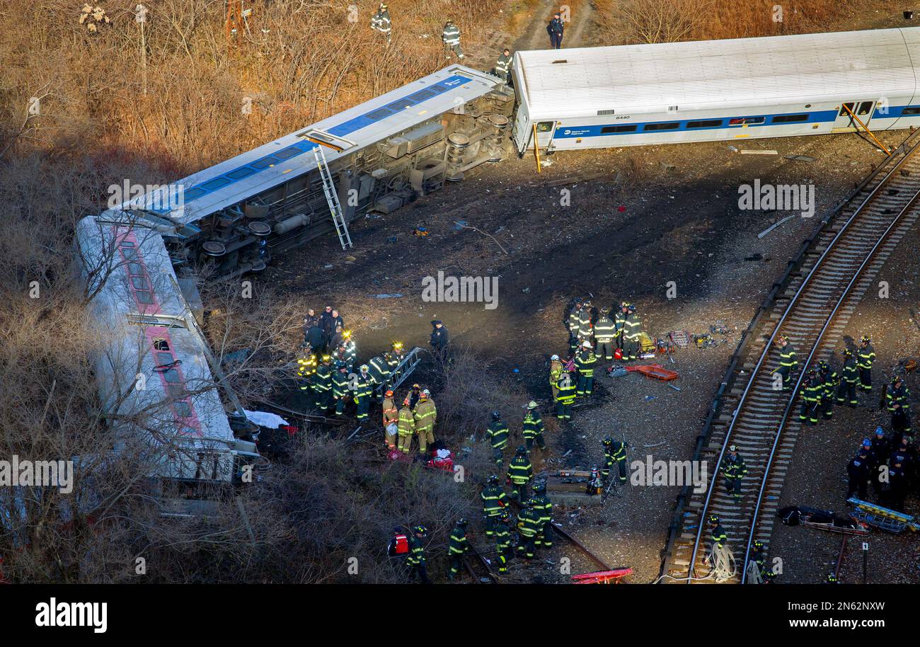 First responders work the scene of a derailment of a Metro-North ...