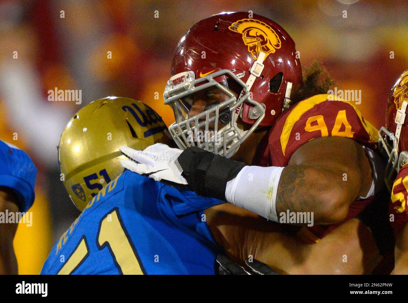 Southern California defensive end Leonard Williams, right, tries to get ...