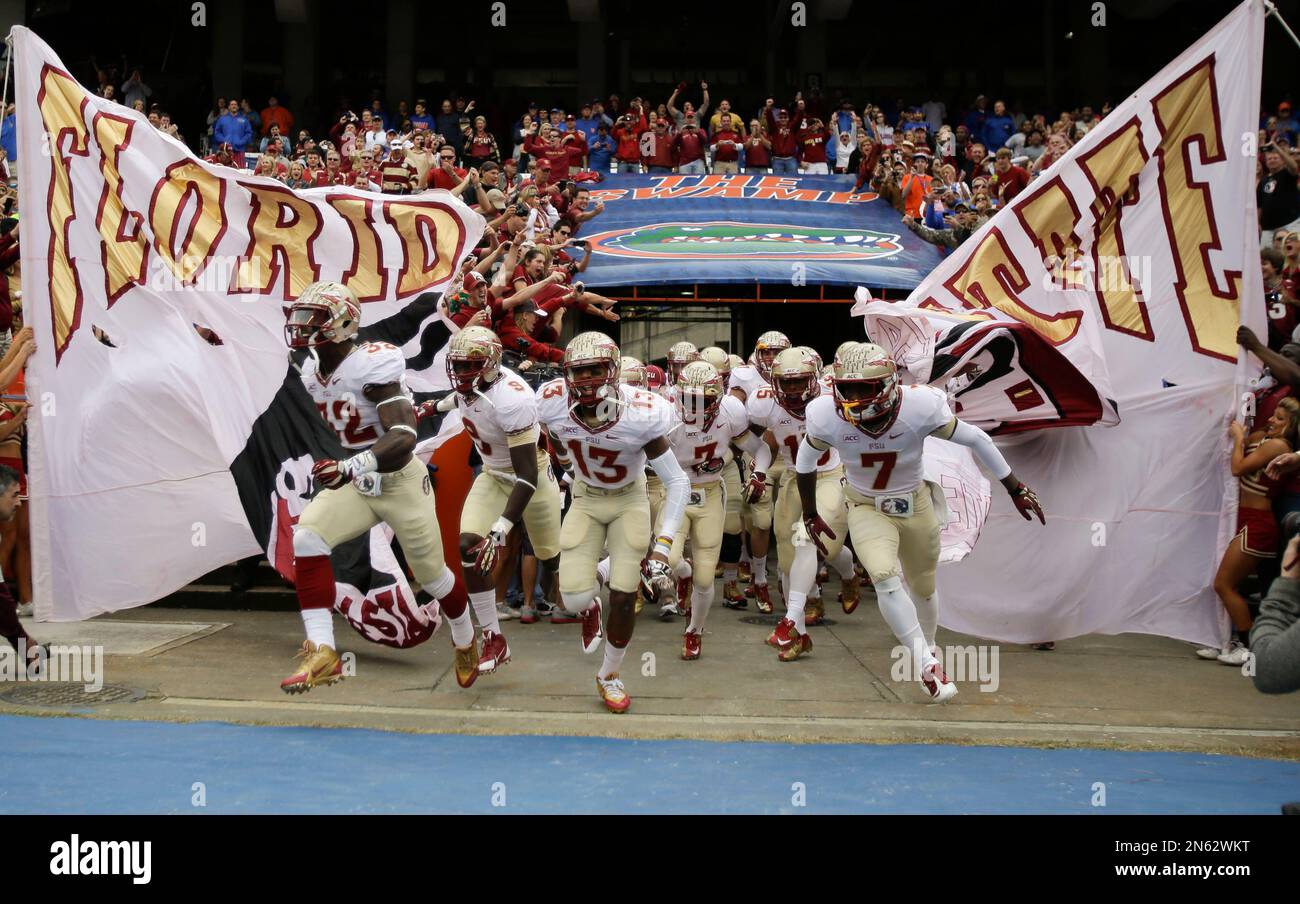 Florida State players take the field against Florida during an NCAA ...
