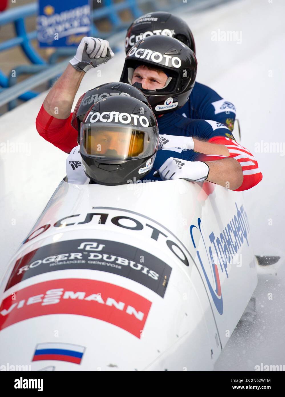 Russia's driver Alexander Zubkov, front, Alexey Negodaylo, Dmitry Trunenkov and Maxim Mokrousov ...