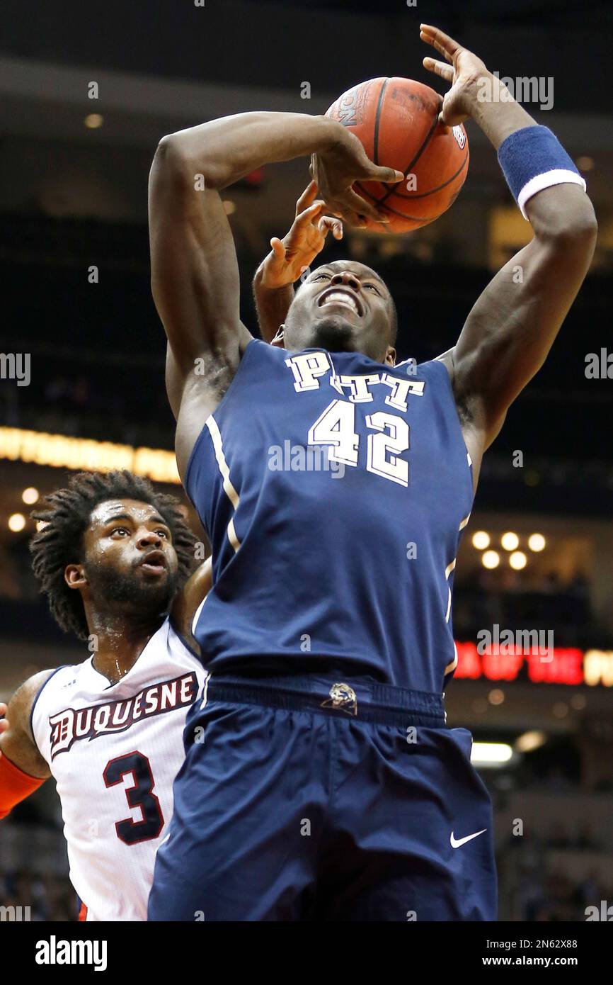 Pittsburgh's Talib Zanna (42) shoots in front of Duquesne's Dominique ...