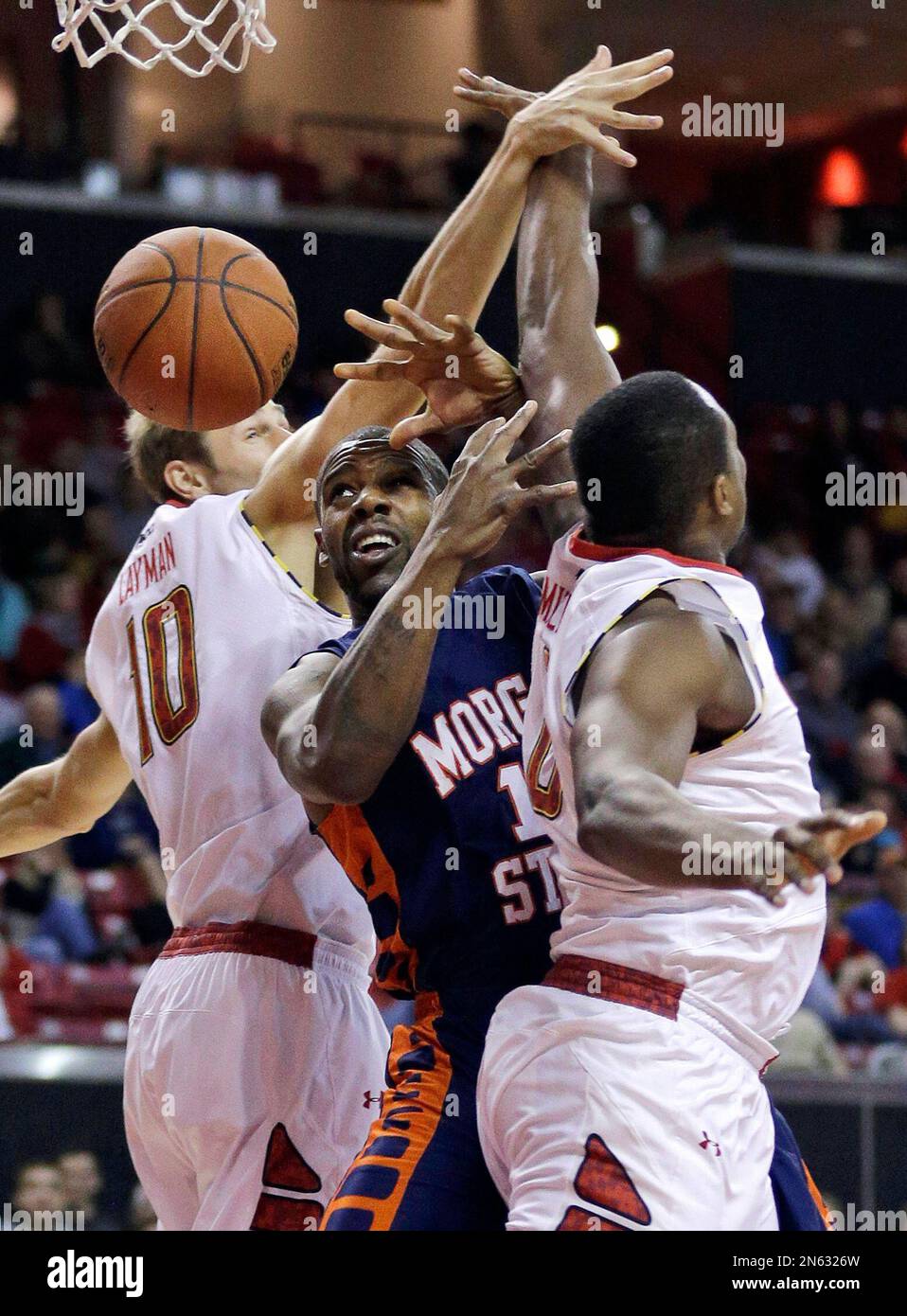 Morgan State guard Anthony Hubbard, center, is fouled by Maryland guard ...