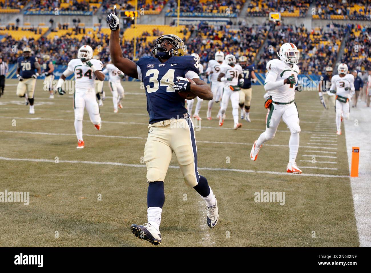 Pittsburgh running back Isaac Bennett (34) celebrates as he runs past ...