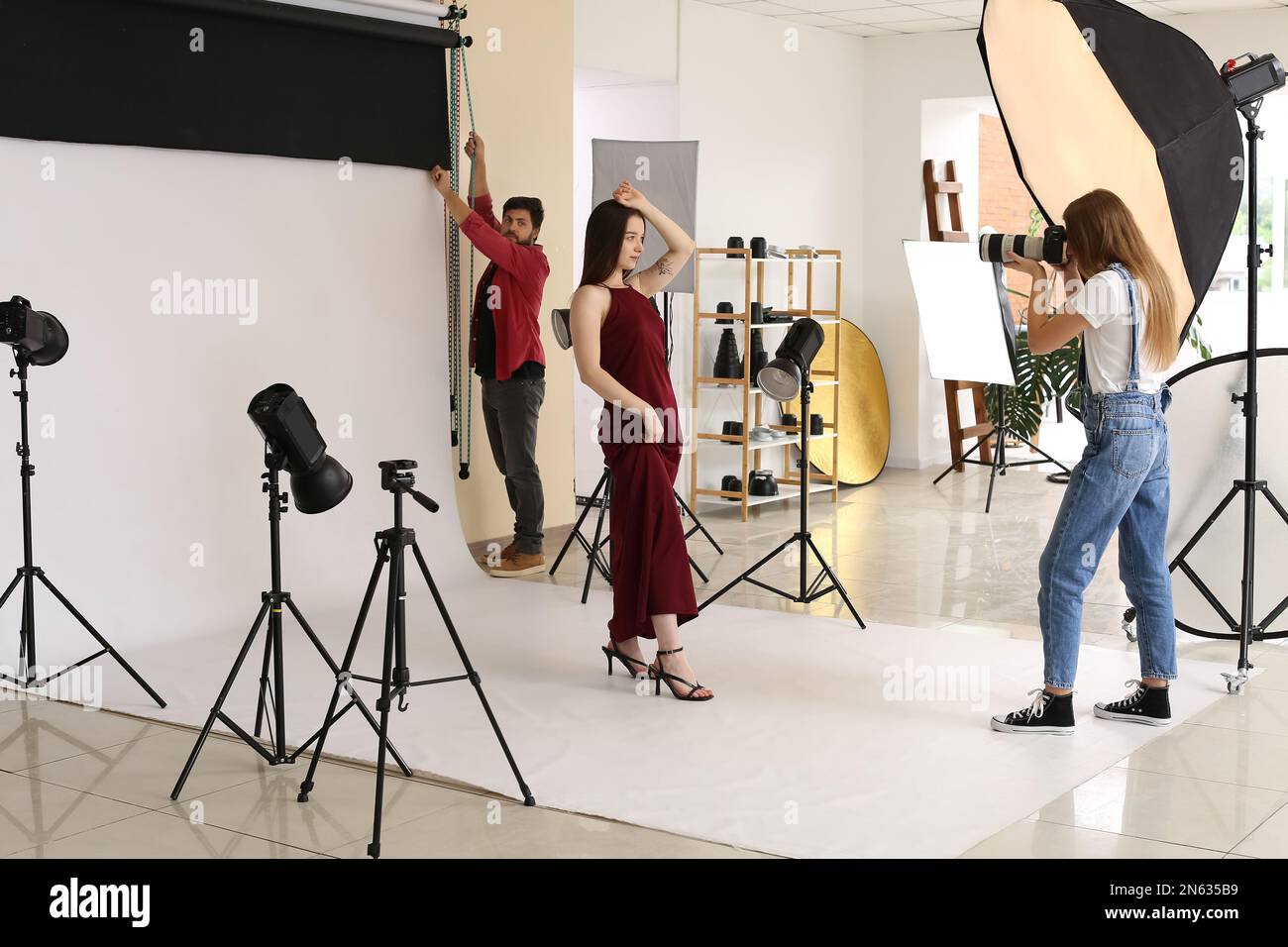 Professional photographer model assistant digital hi-res stock ...